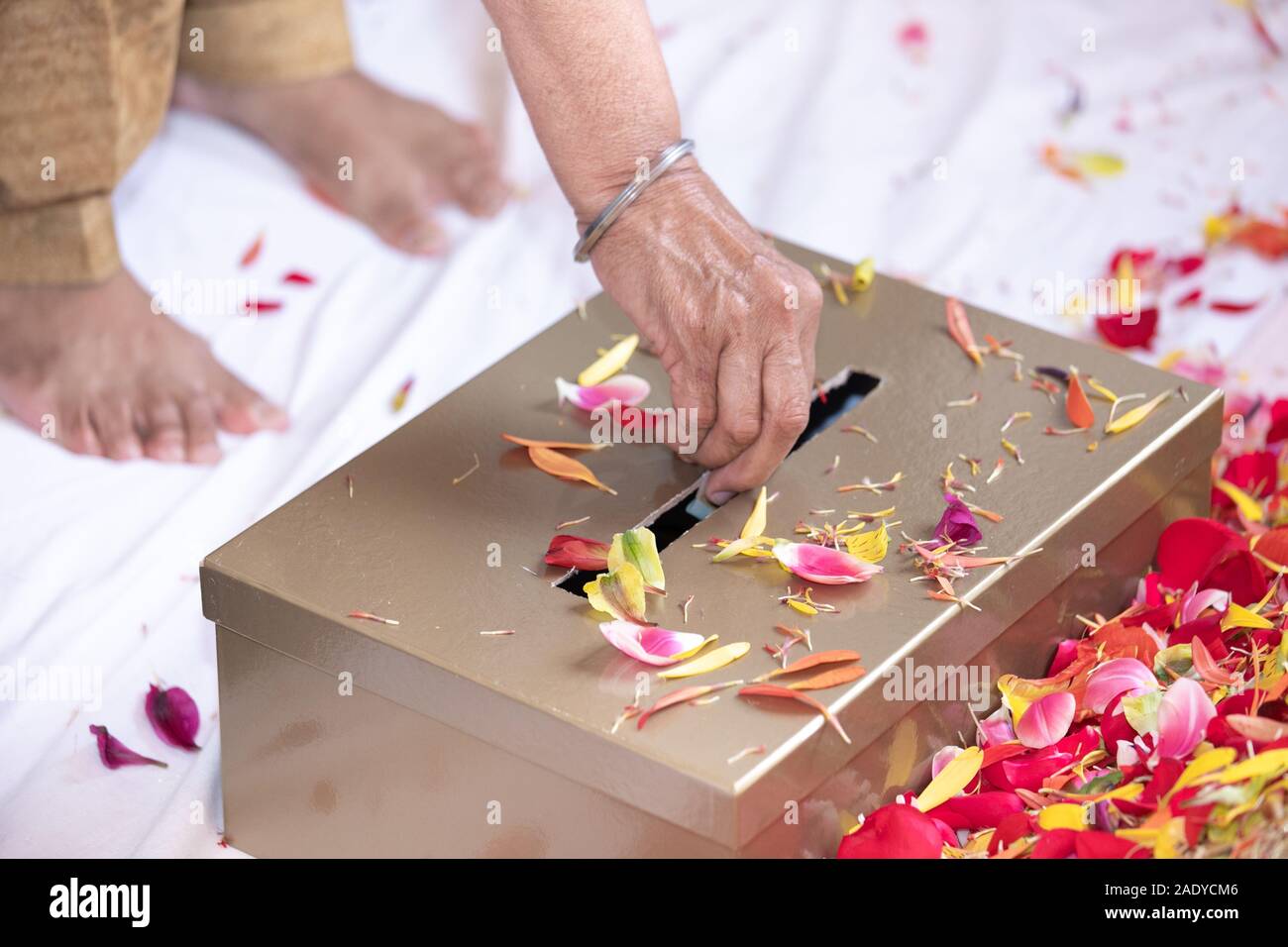 Indian sikh traditional ceremony ritual items, donation box, hands ...