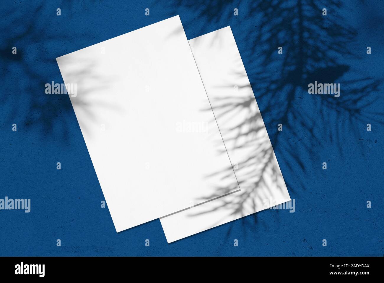 Empty white vertical rectangle poster mockups lying on each other with ...