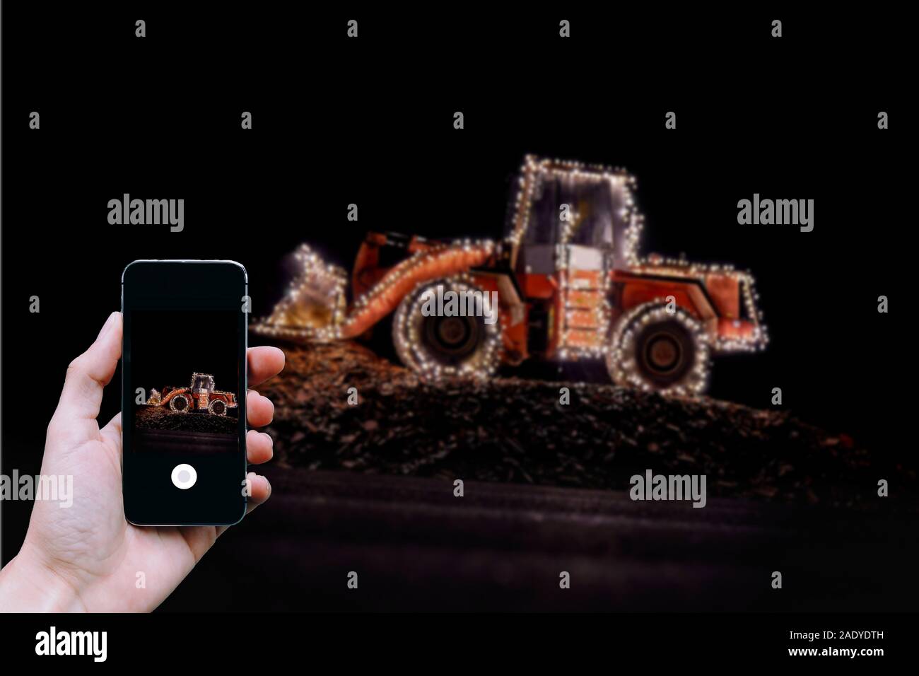 Mobile picture of a Blurred wheel loader decorated with lights at ...