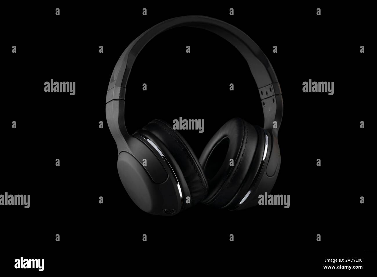 Black wireless headphones isolated on a black background Stock Photo ...