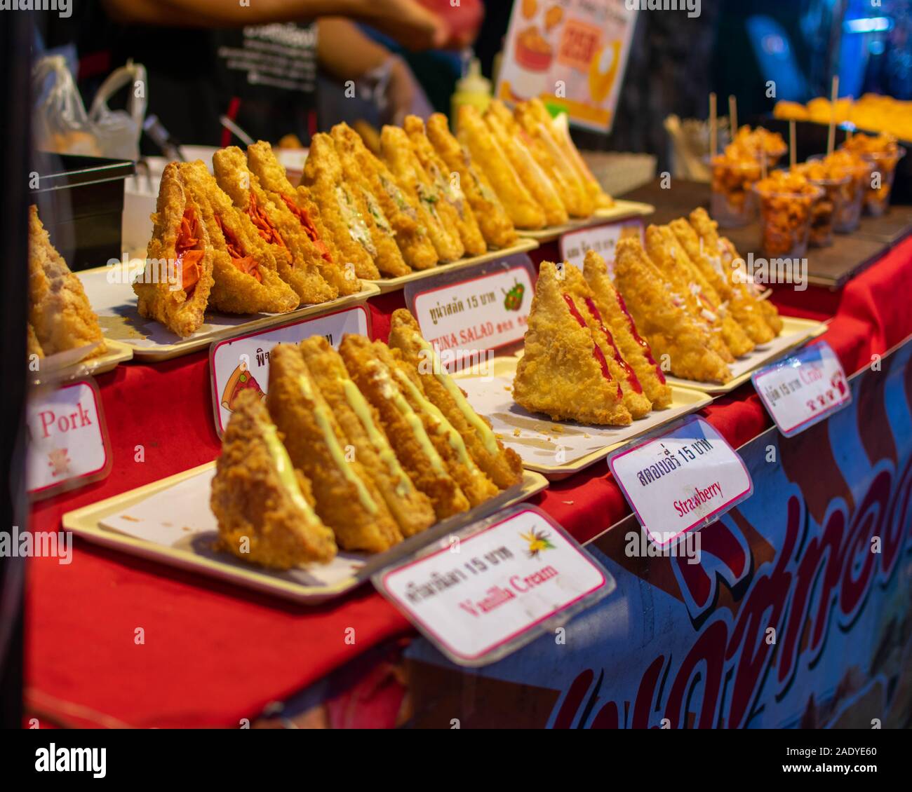 Deep fried sandwiches being sold from a stall at a night market in ...