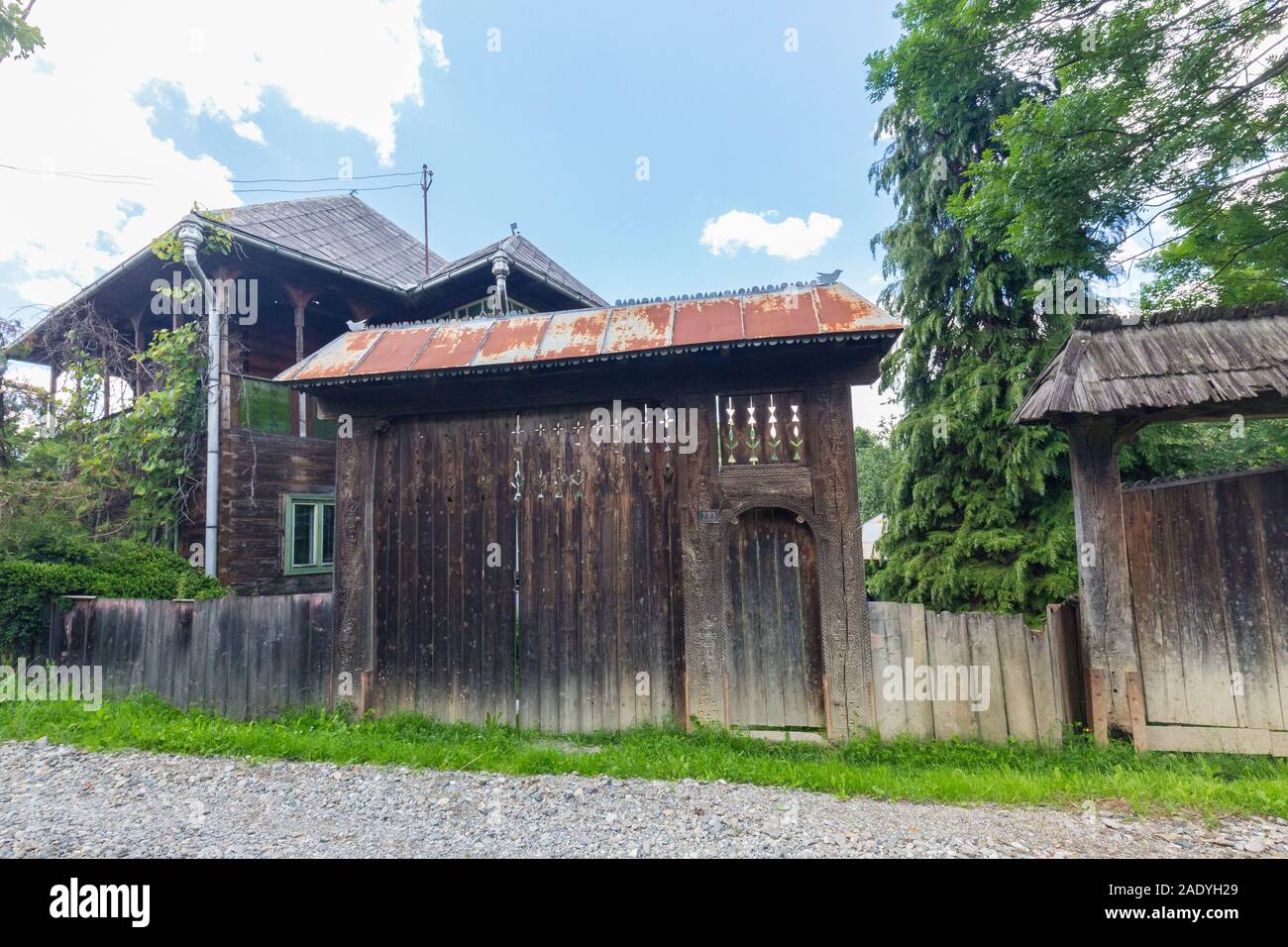 Traditional, wooden gates with different patterns in the village of ...