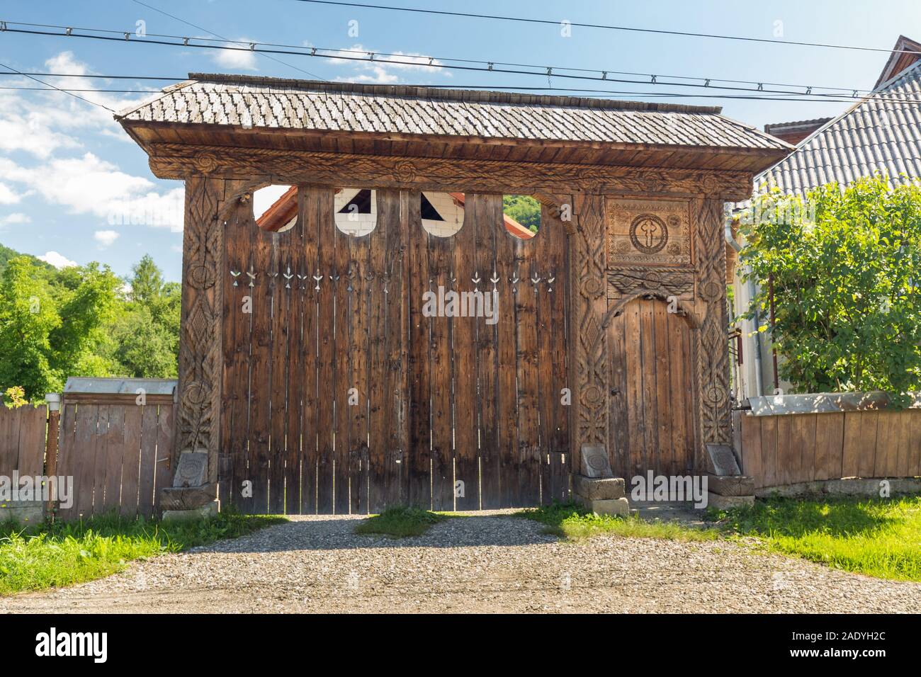 Traditional, wooden gates with different patterns in the village of ...