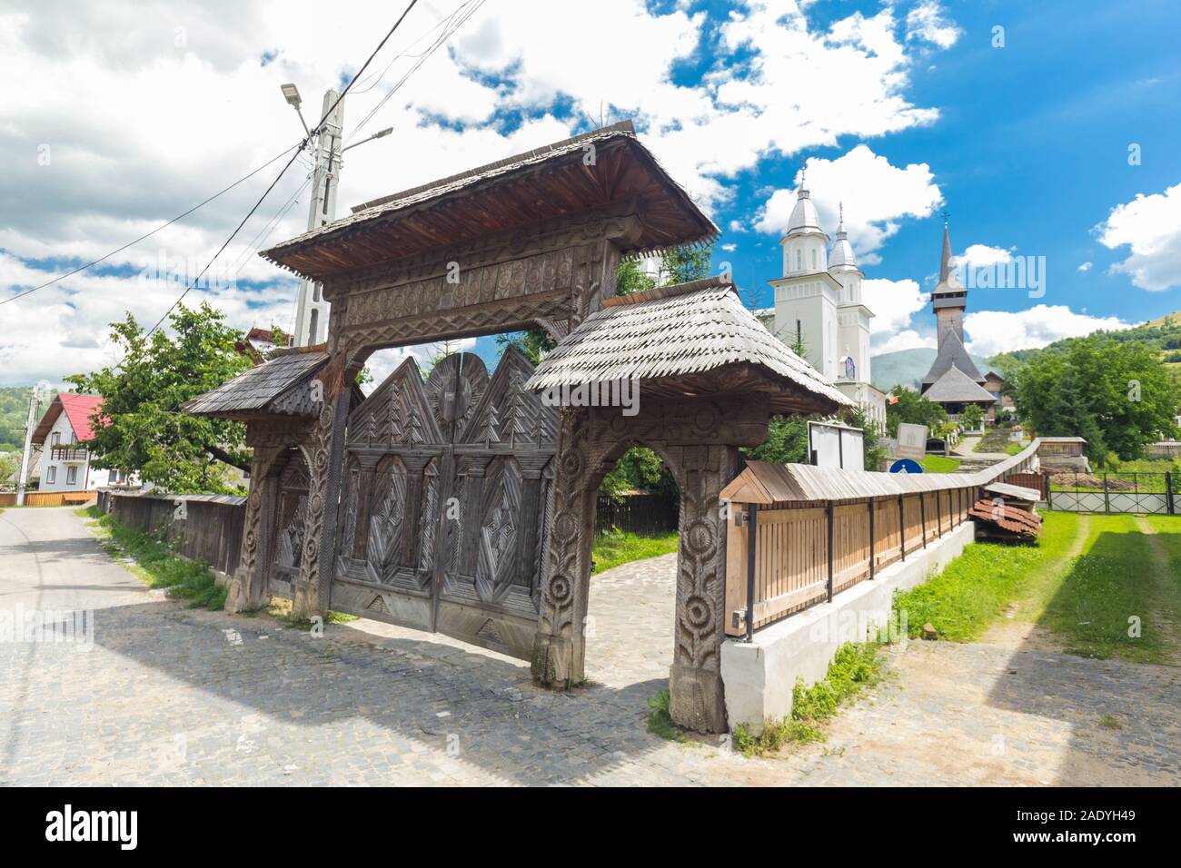 Traditional, wooden gates with different patterns in the village of ...