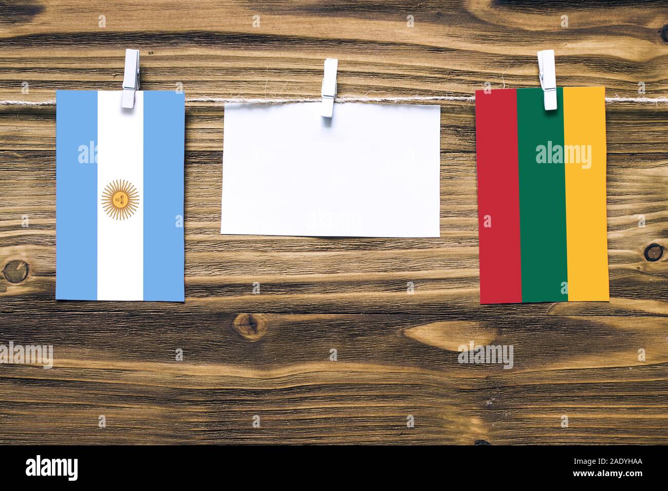 Hanging flags of Argentina and Lithuania attached to rope with clothes ...