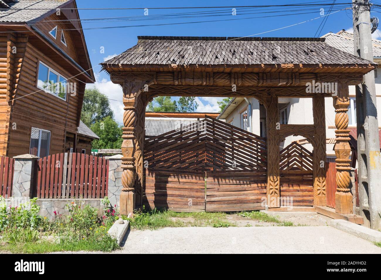 Traditional, wooden gates with different patterns in the village of ...