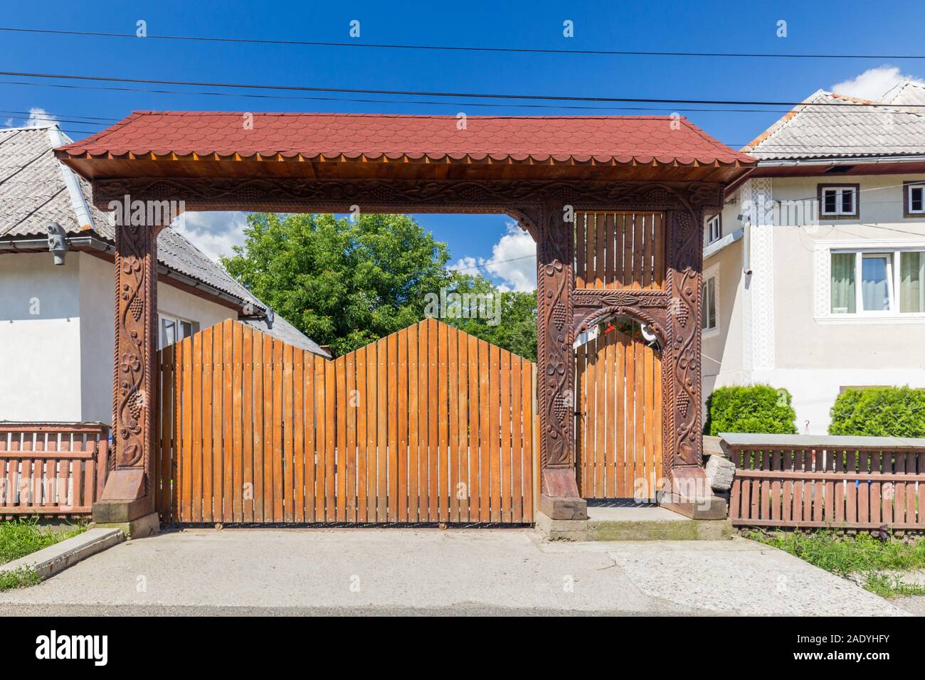 Traditional, wooden gates with different patterns in the village of ...