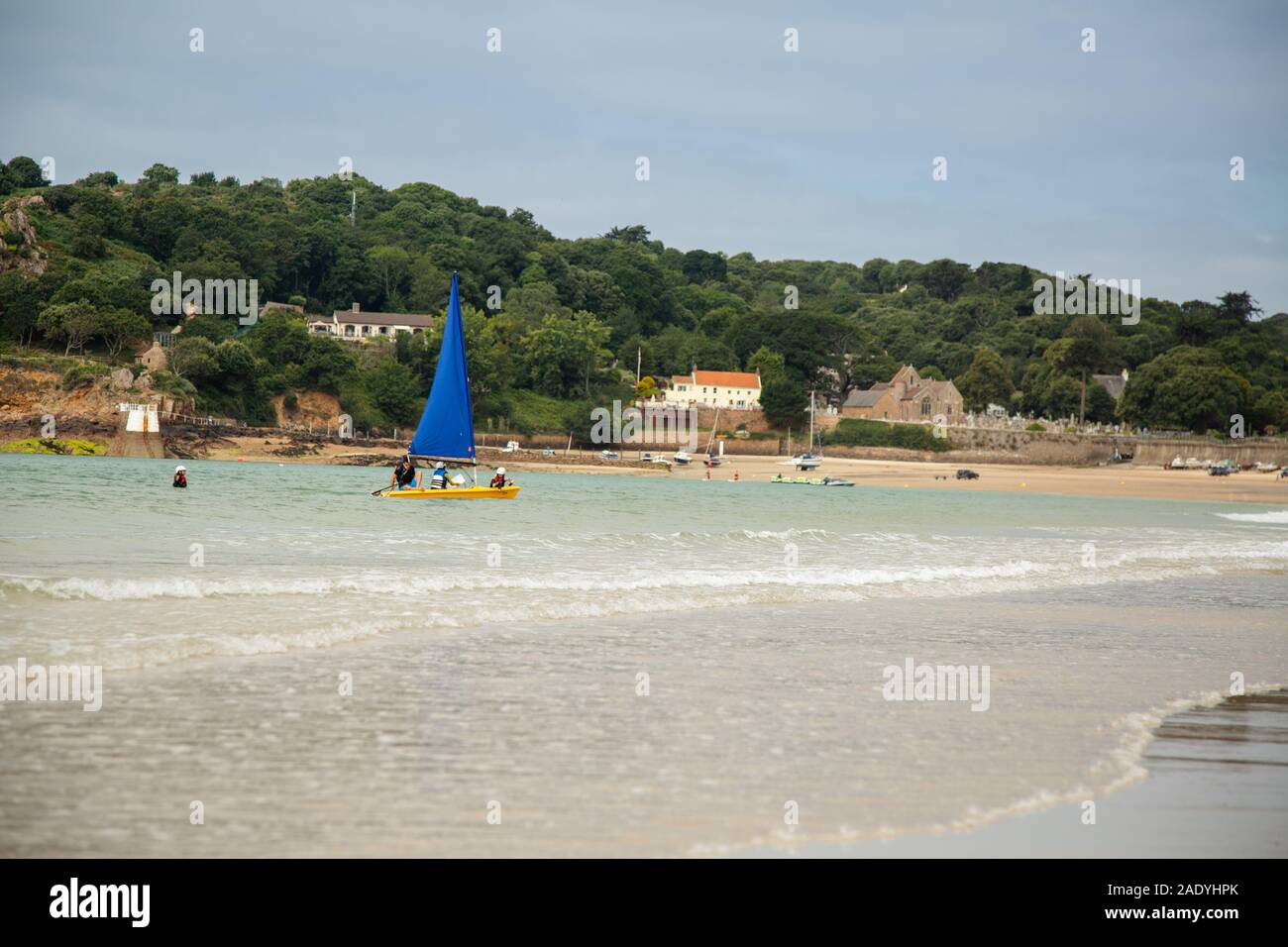 Sailing boat (dinghy) on the coast of Jersey, Channel Islands Stock ...
