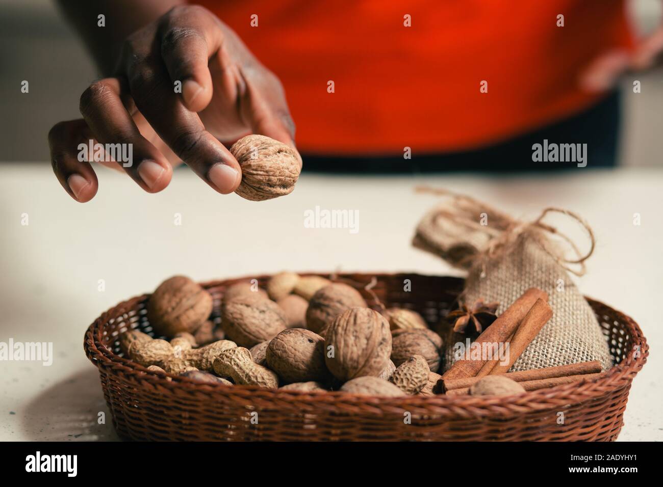 Hand holding walnut hi-res stock photography and images - Alamy