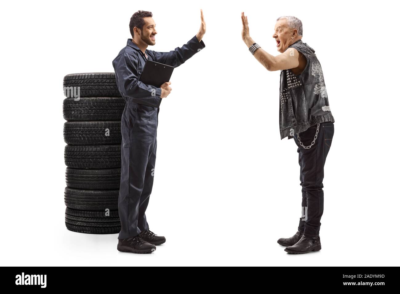 Full length profile shot of an auto mechanic and an elderly man in ...
