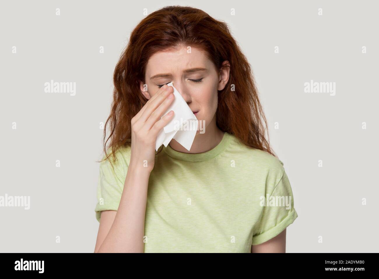 Depressed millennial red-haired woman crying Stock Photo - Alamy