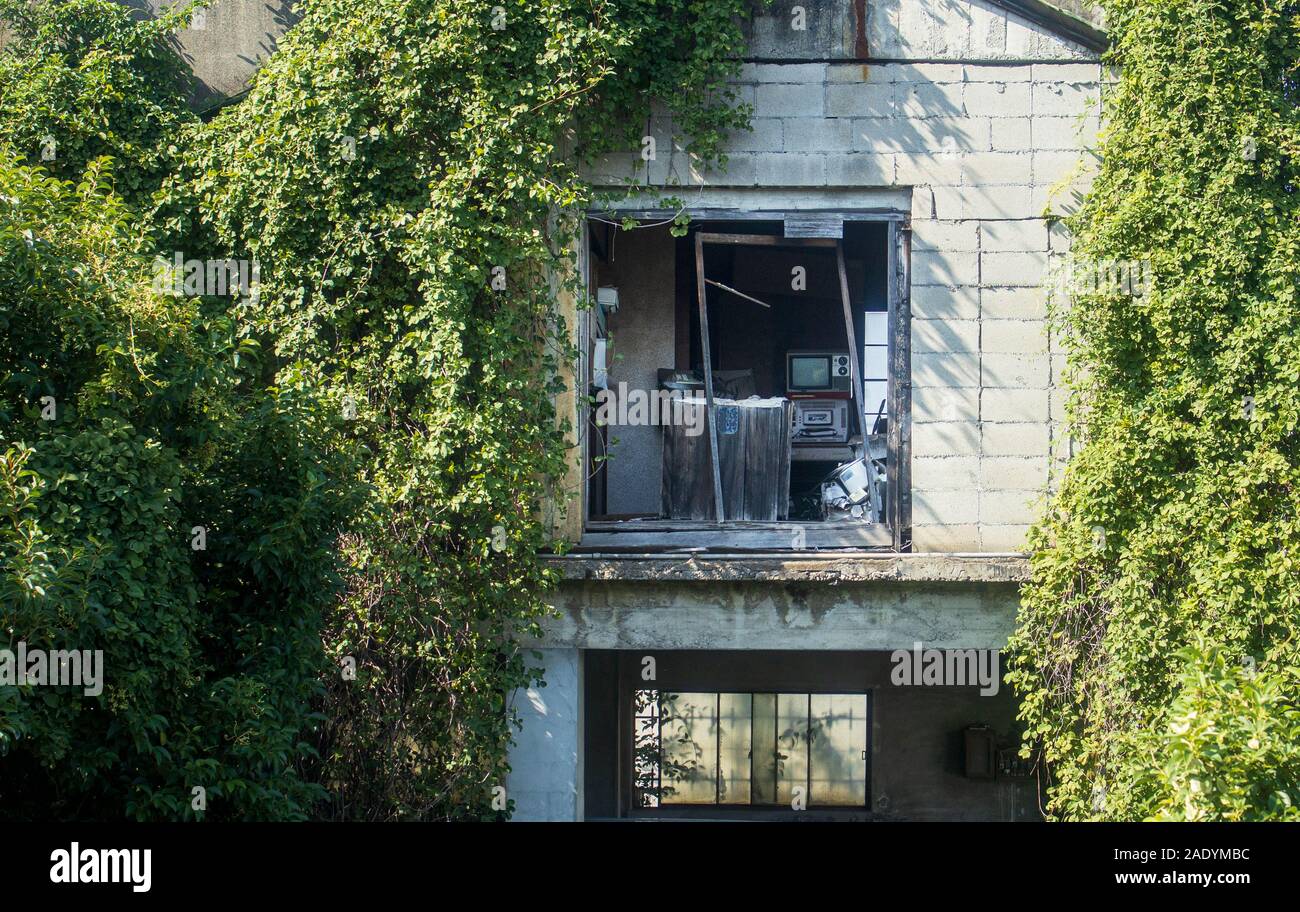 Old tube television in broken window of rundown building Stock Photo ...