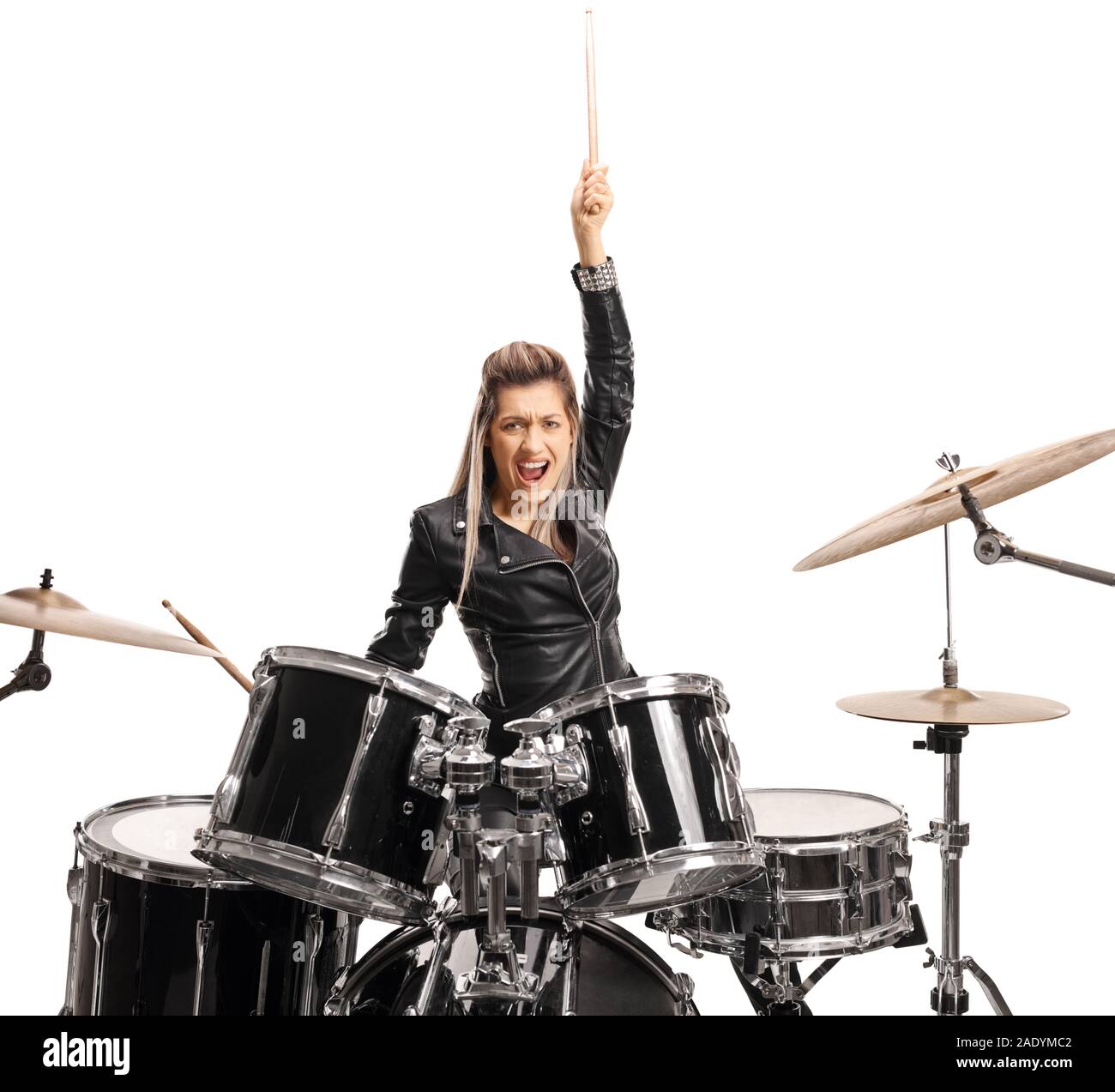 Excited female drummer raising a drumstick isolated on white background ...