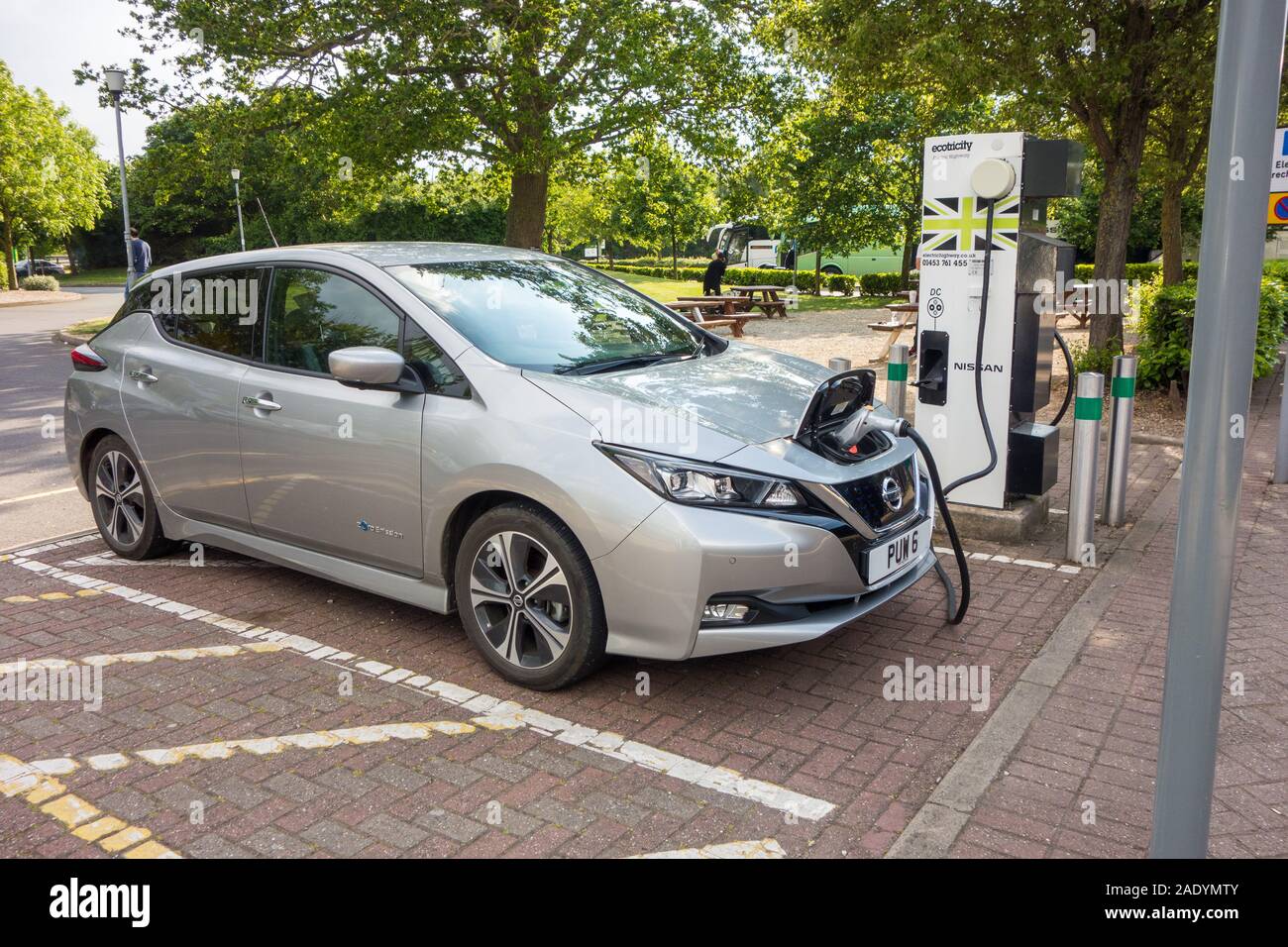 Nissan LEAF electric car being recharged at the recharging point at ...