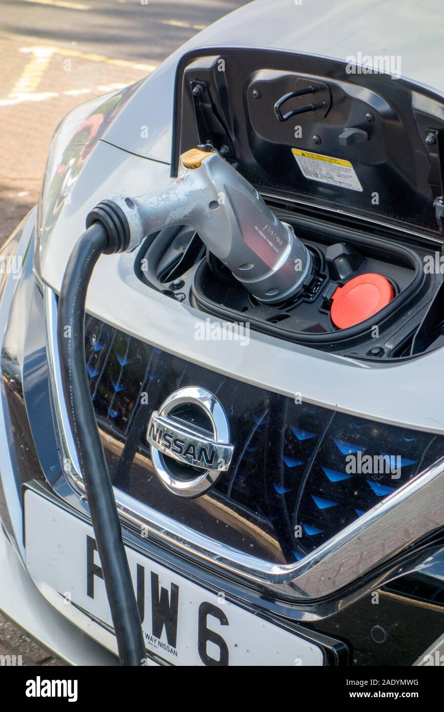 Nissan LEAF electric car being recharged at the recharging point at ...