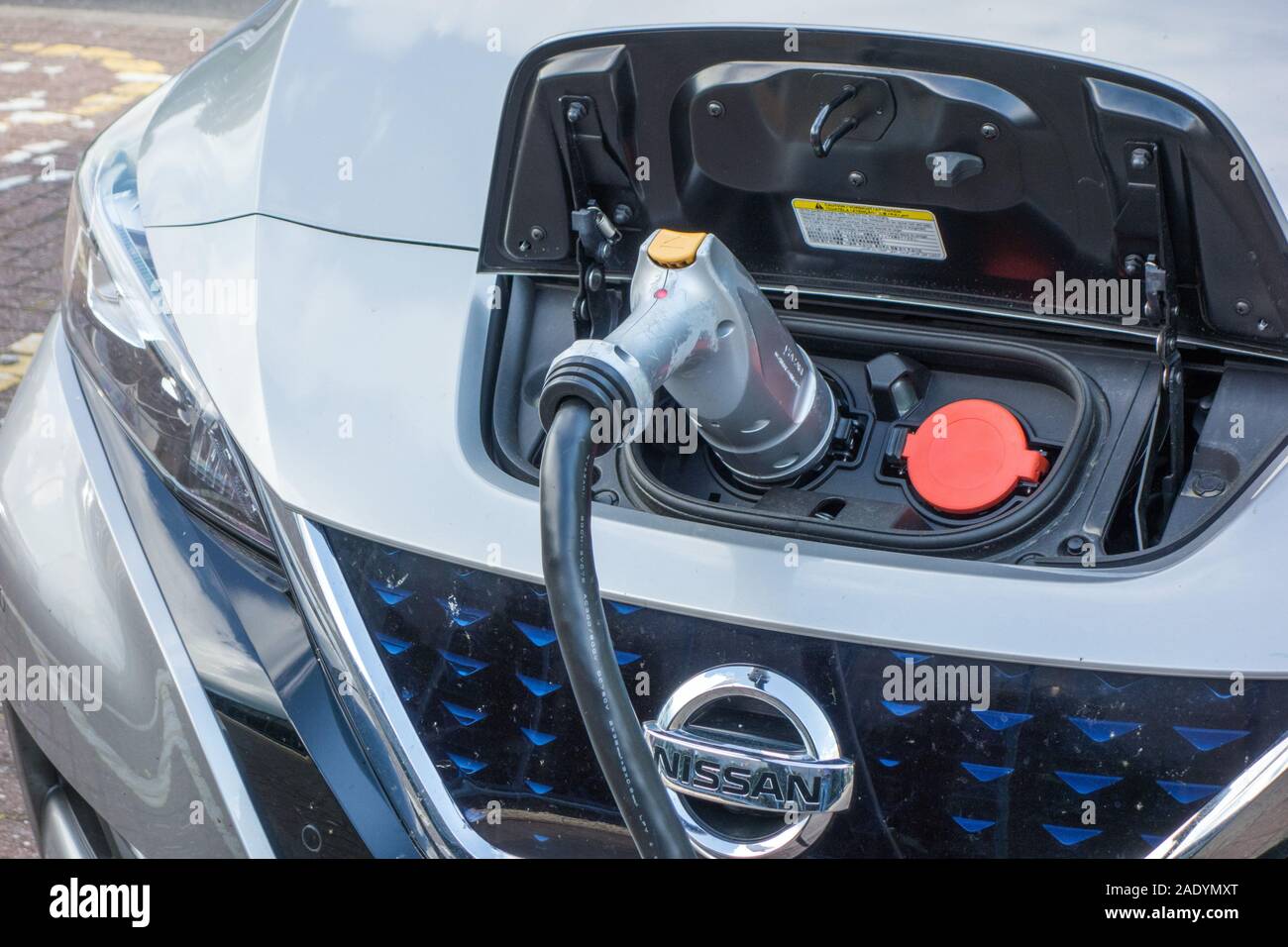 Nissan LEAF electric car being recharged at the recharging point at ...