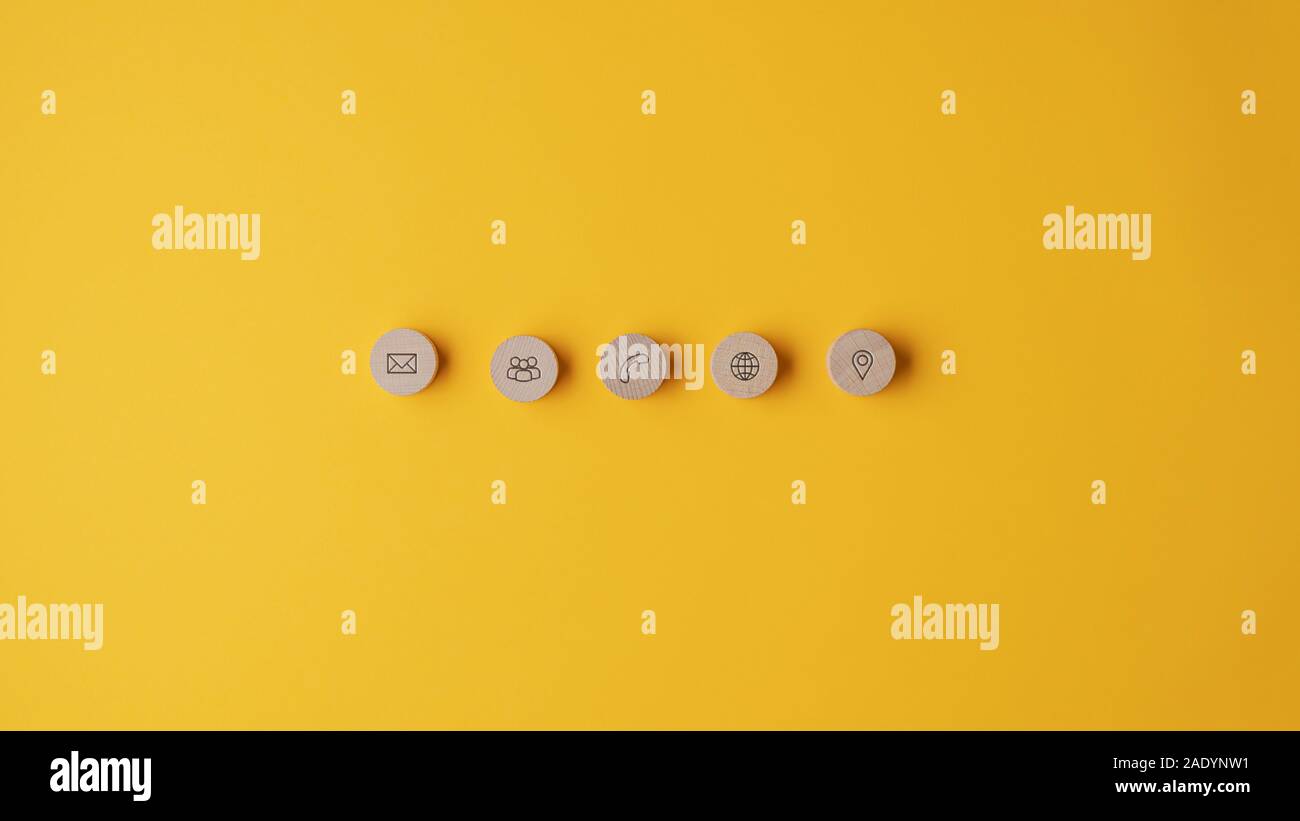 Five wooden cut circles with contact and information icons on them ...