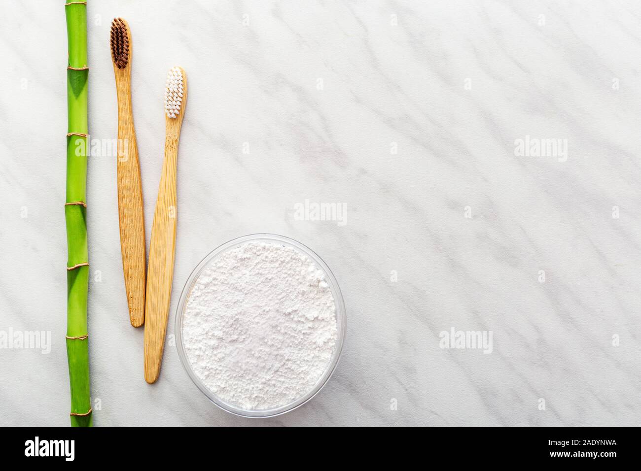 Bamboo toothbrush, bamboo plant dentifrice tooth powder on white marble ...