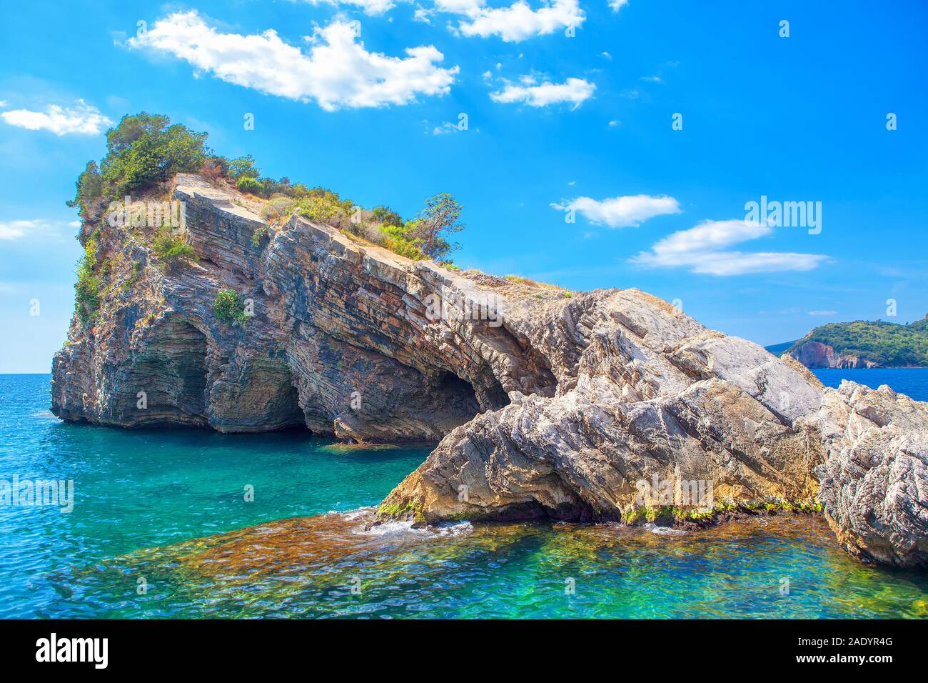 stony island surrounded by the sea Stock Photo - Alamy