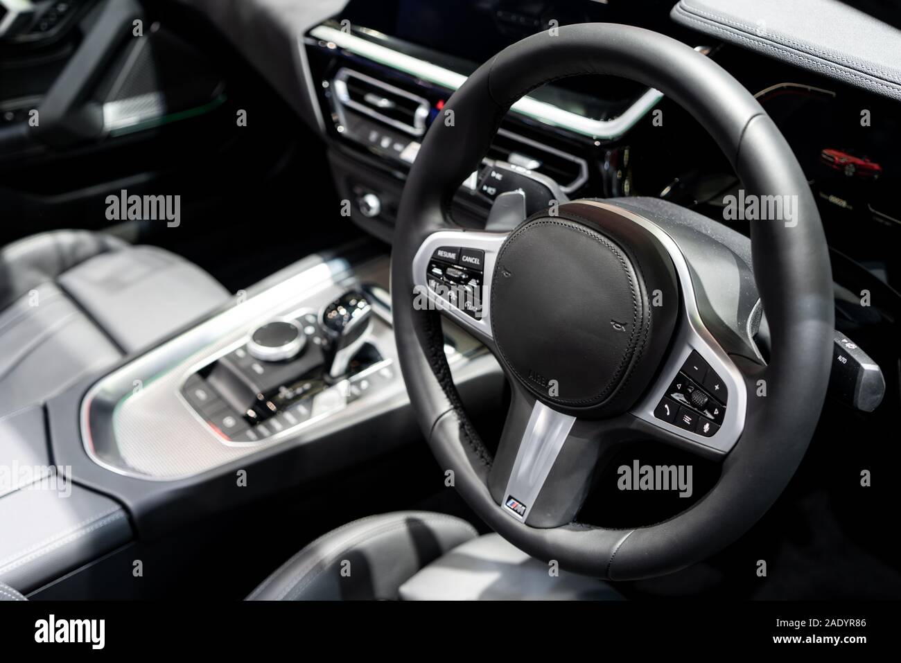 Dark luxury car Interior - steering wheel, shift lever and dashboard ...