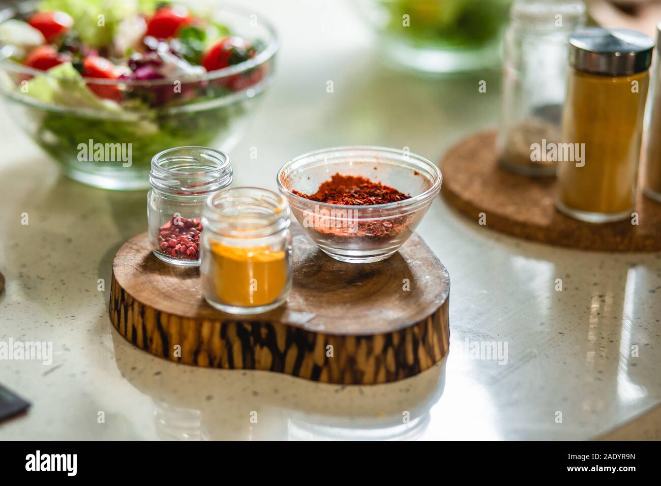 Close up of spices on the wooden stand on the table Stock Photo - Alamy