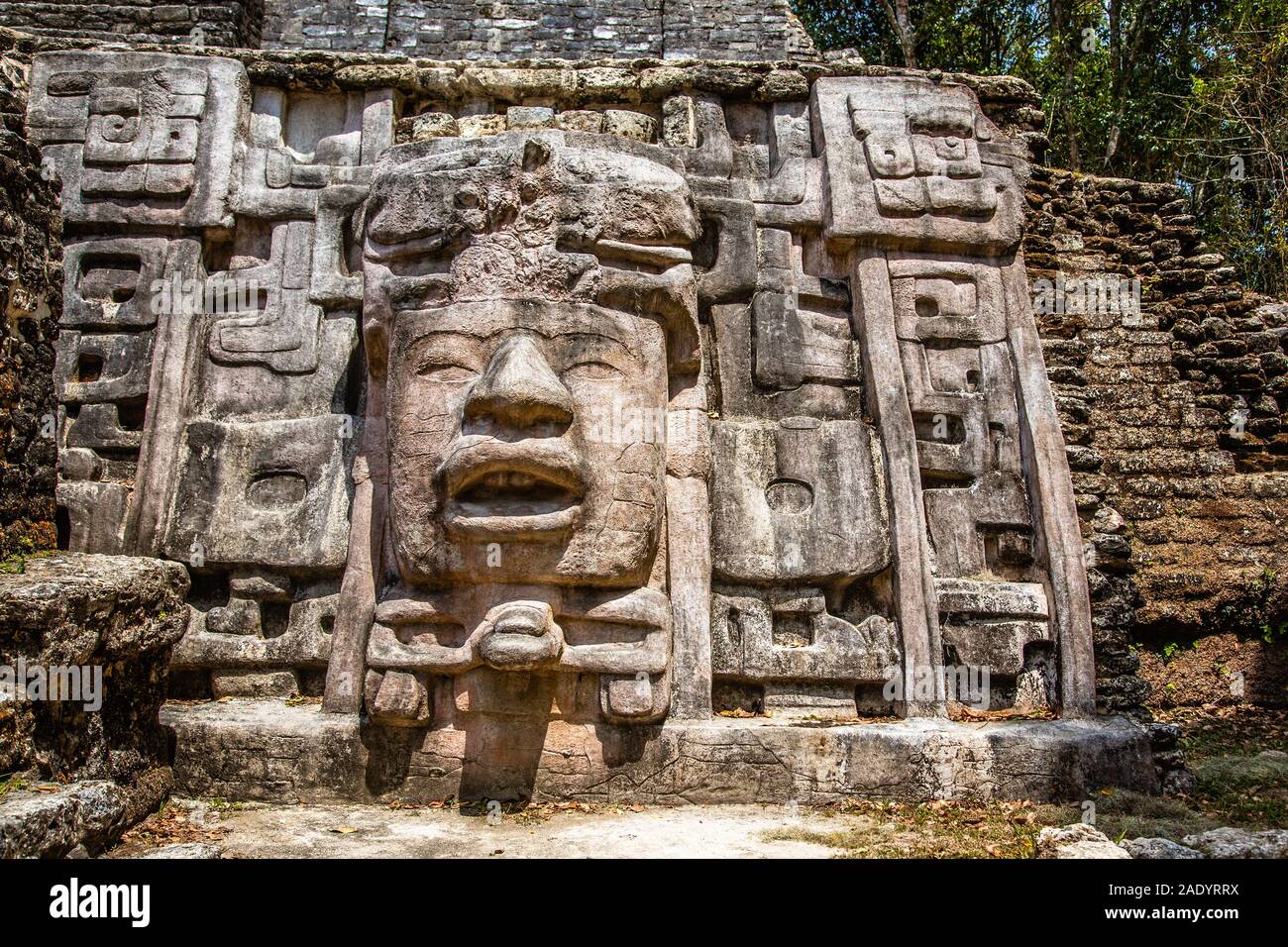 Old ancient stone Mayan pre-columbian civilization carved face and ...