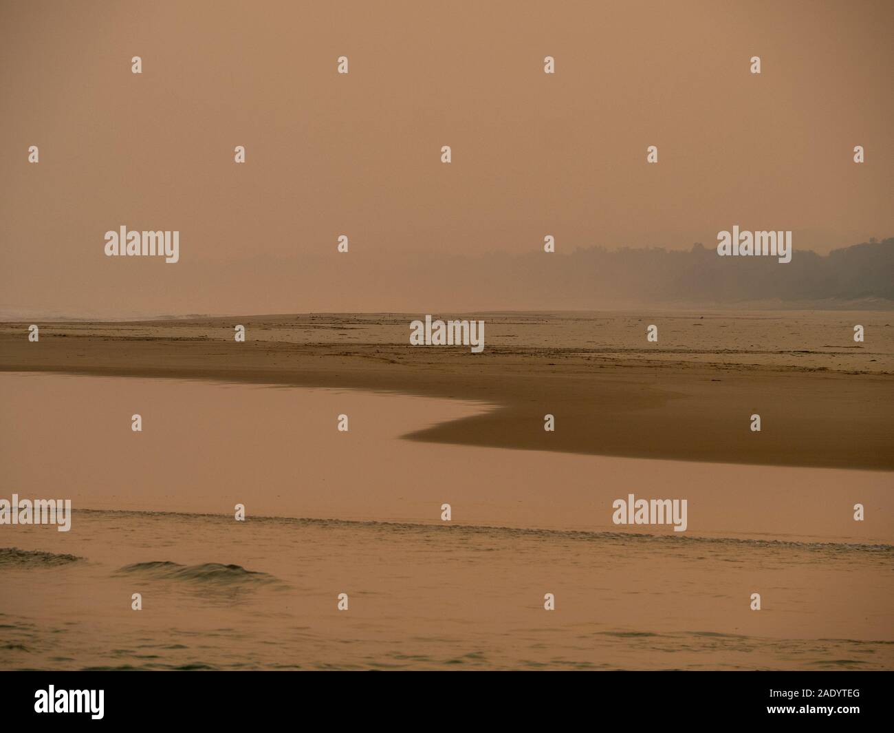smoke haze at sunset by the beach and sea, Australia Stock Photo - Alamy