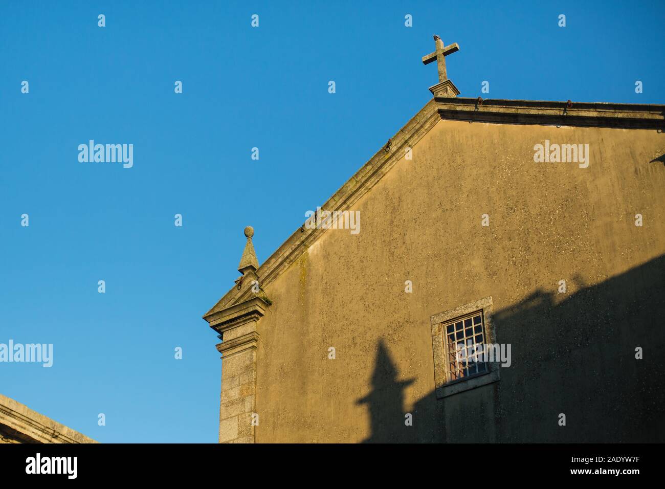 The wall of the ancient Catholic Church against the sky Stock Photo - Alamy