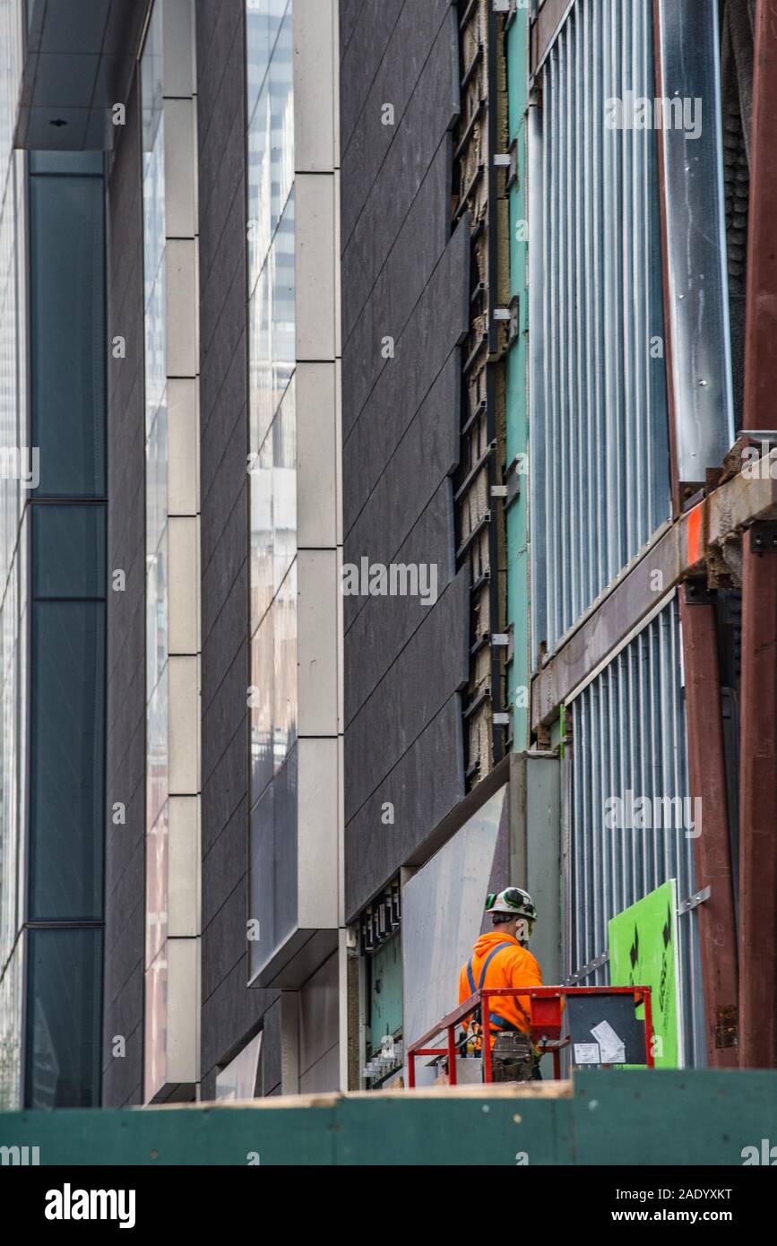 Steel beam construction workers on high rise office building in Hudson ...