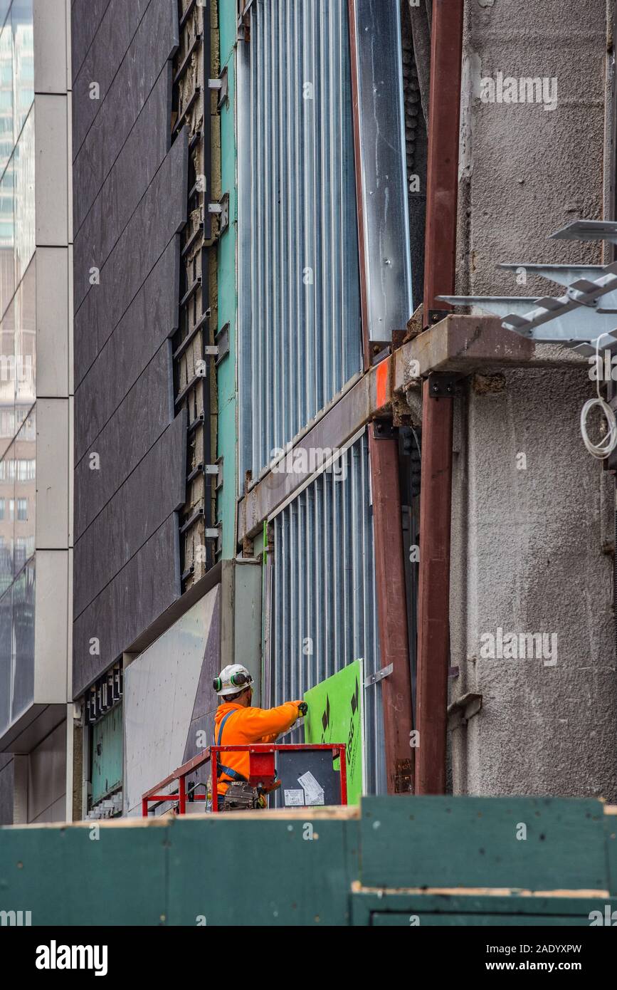 Steel beam construction workers on high rise office building in Hudson ...