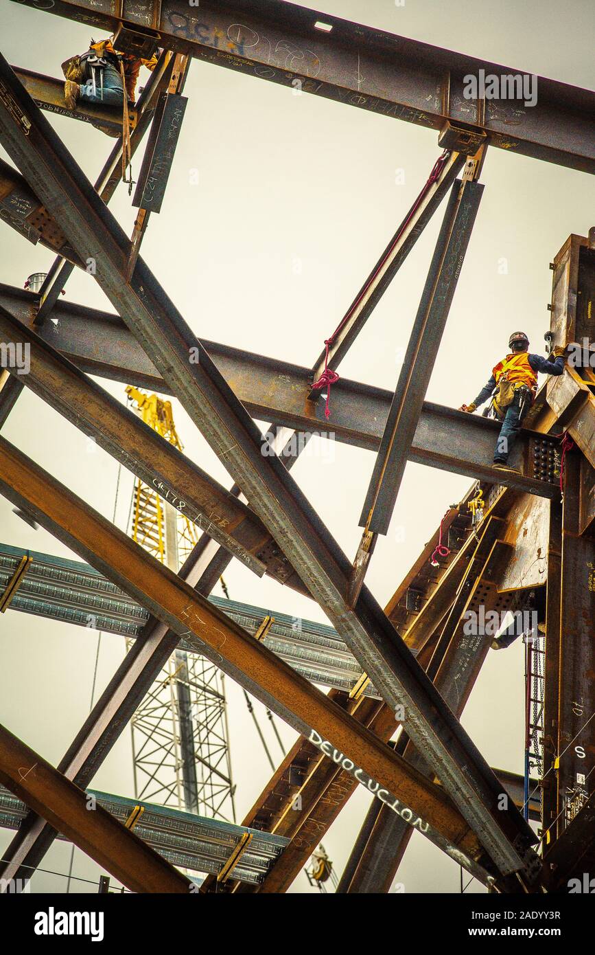 Steel beam construction workers on high rise office building in Hudson ...