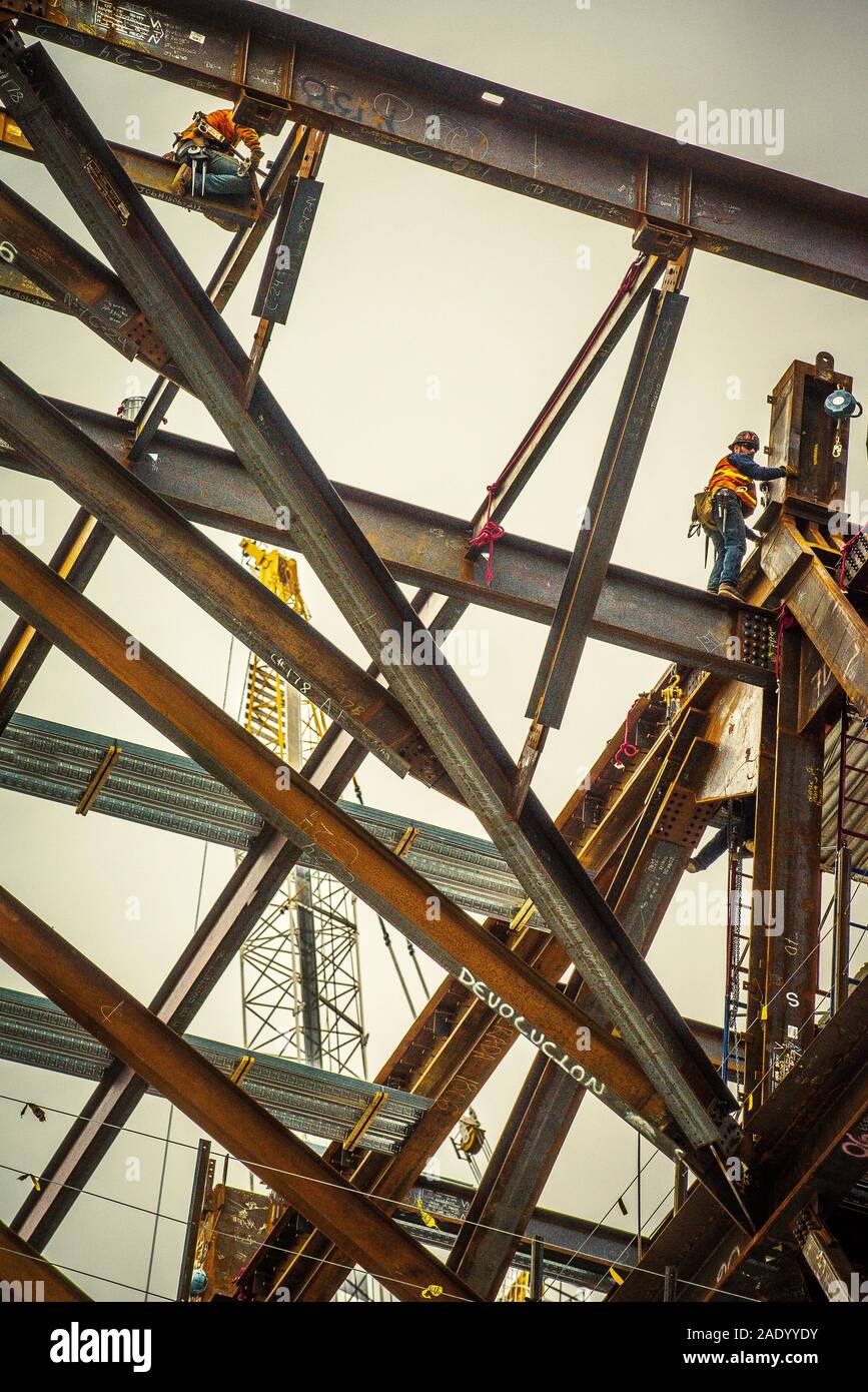 Steel beam construction workers on high rise office building in Hudson ...