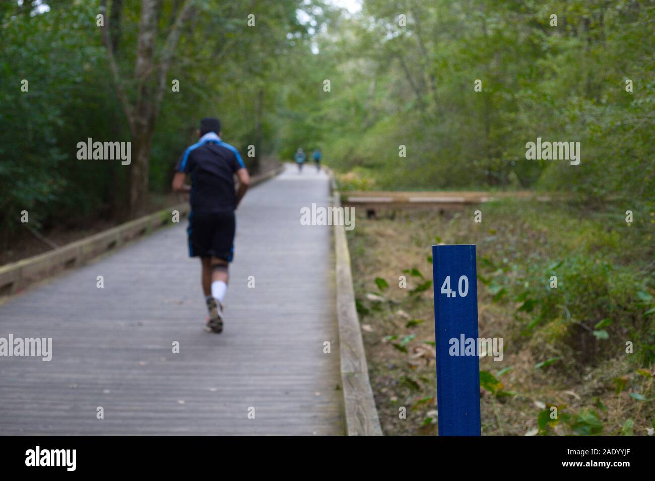 Man Running at Mile Four Stock Photo - Alamy