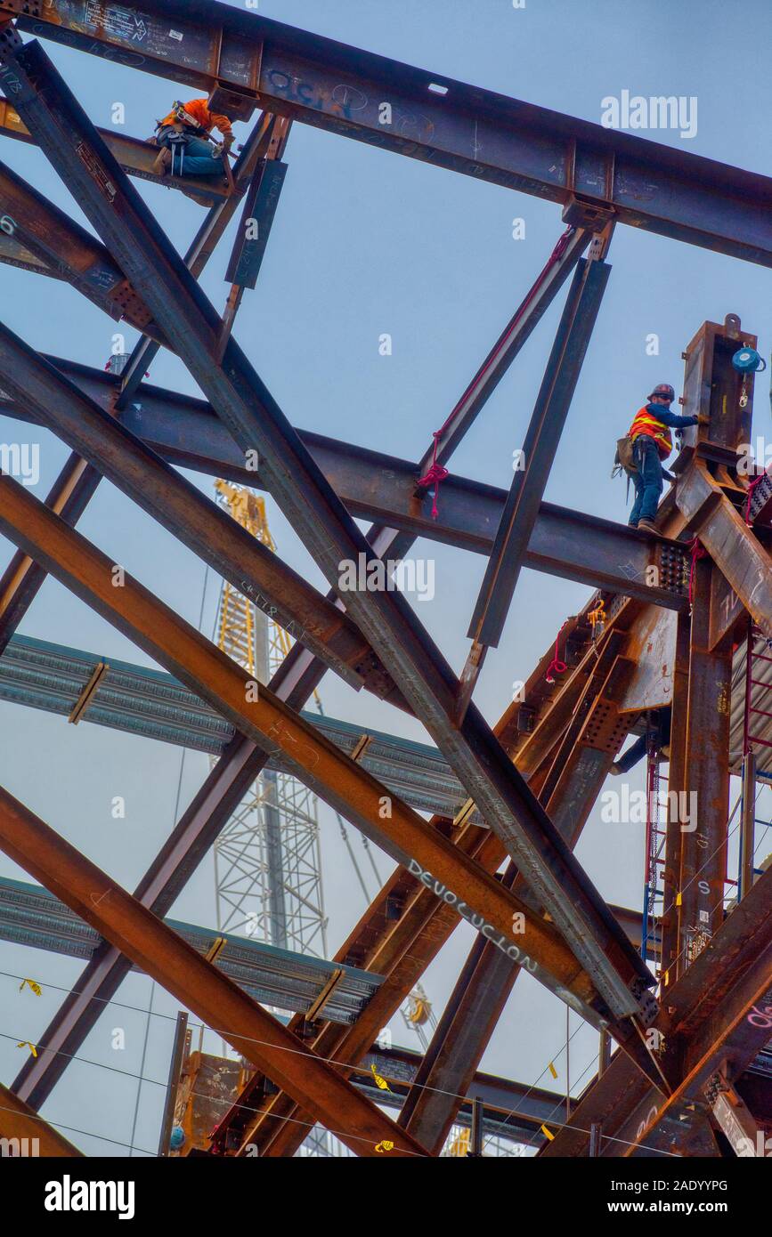 Steel beam construction workers on high rise office building in Hudson ...