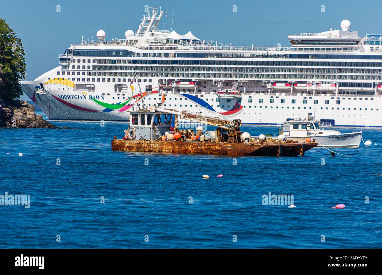 Rusty Barge by Cruise Ship Stock Photo - Alamy