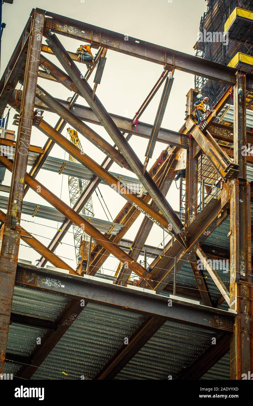 Steel beam construction workers on high rise office building in Hudson ...