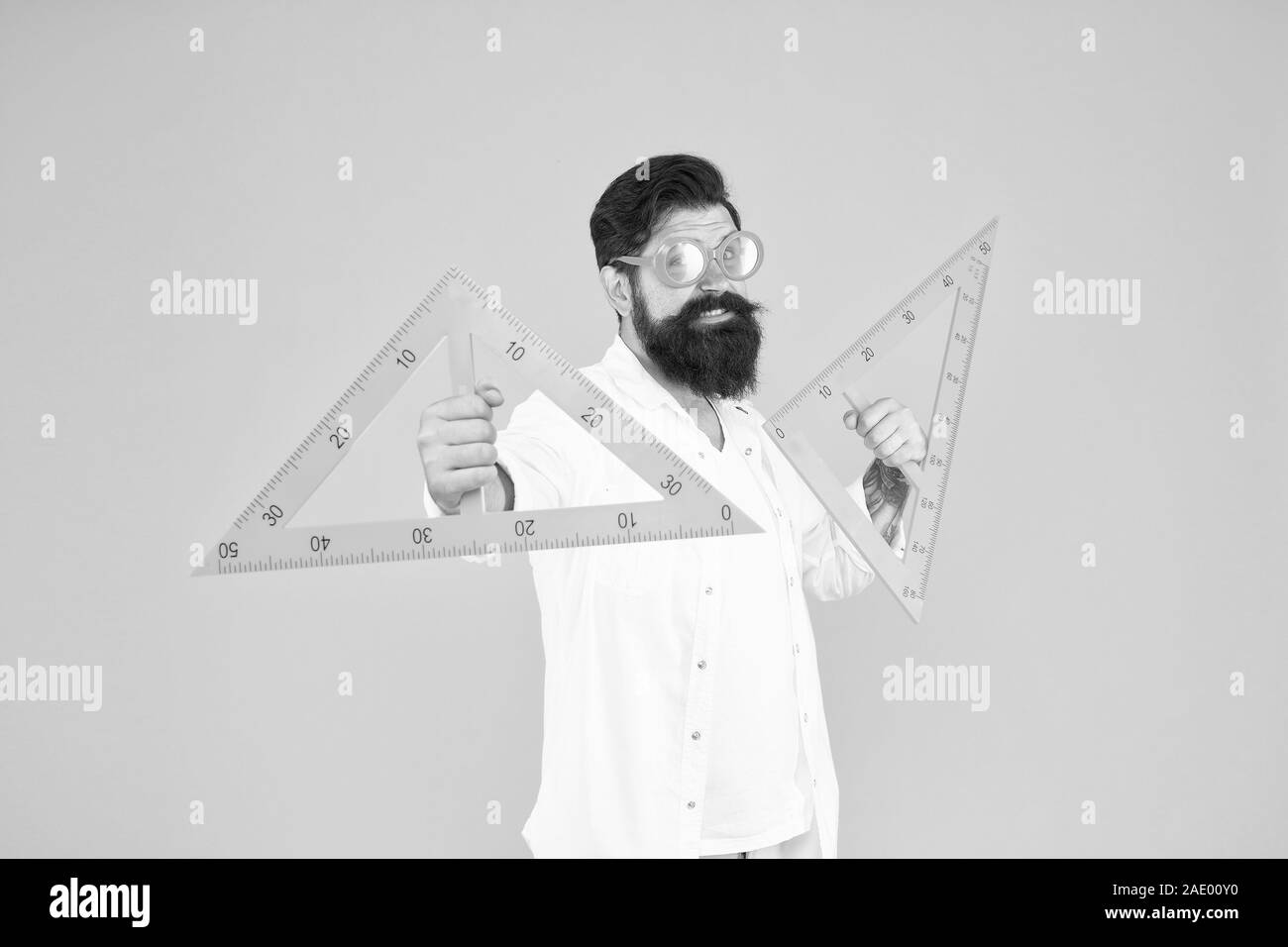 Man math lesson. Bearded nerd triangle. Geometry teacher. Student using ...