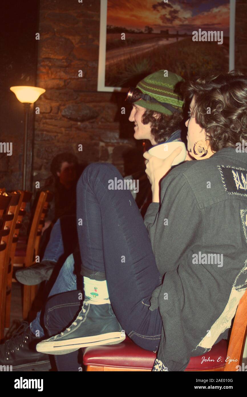 Young teenagers sit and watch the performance Stock Photo - Alamy