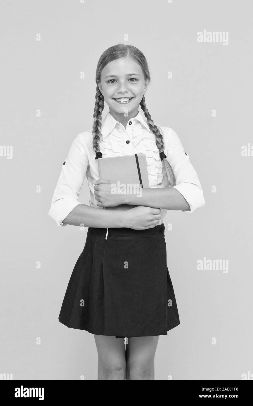 Being proud of her knowledge. Cute little child with school knowledge ...
