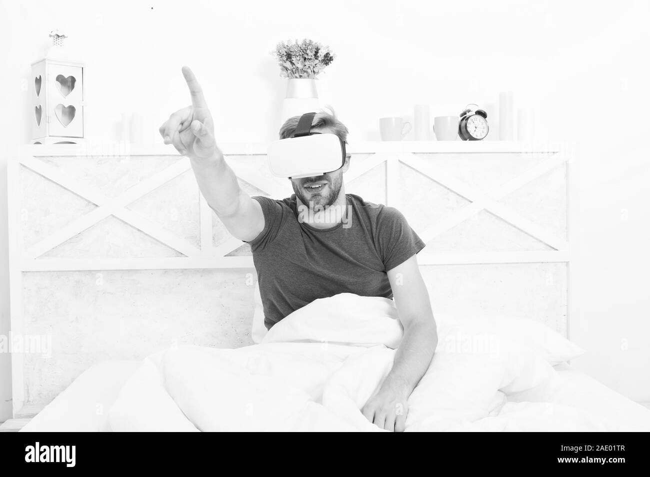 Return to reality. Man explore vr while relaxing in bed. Awakening from ...
