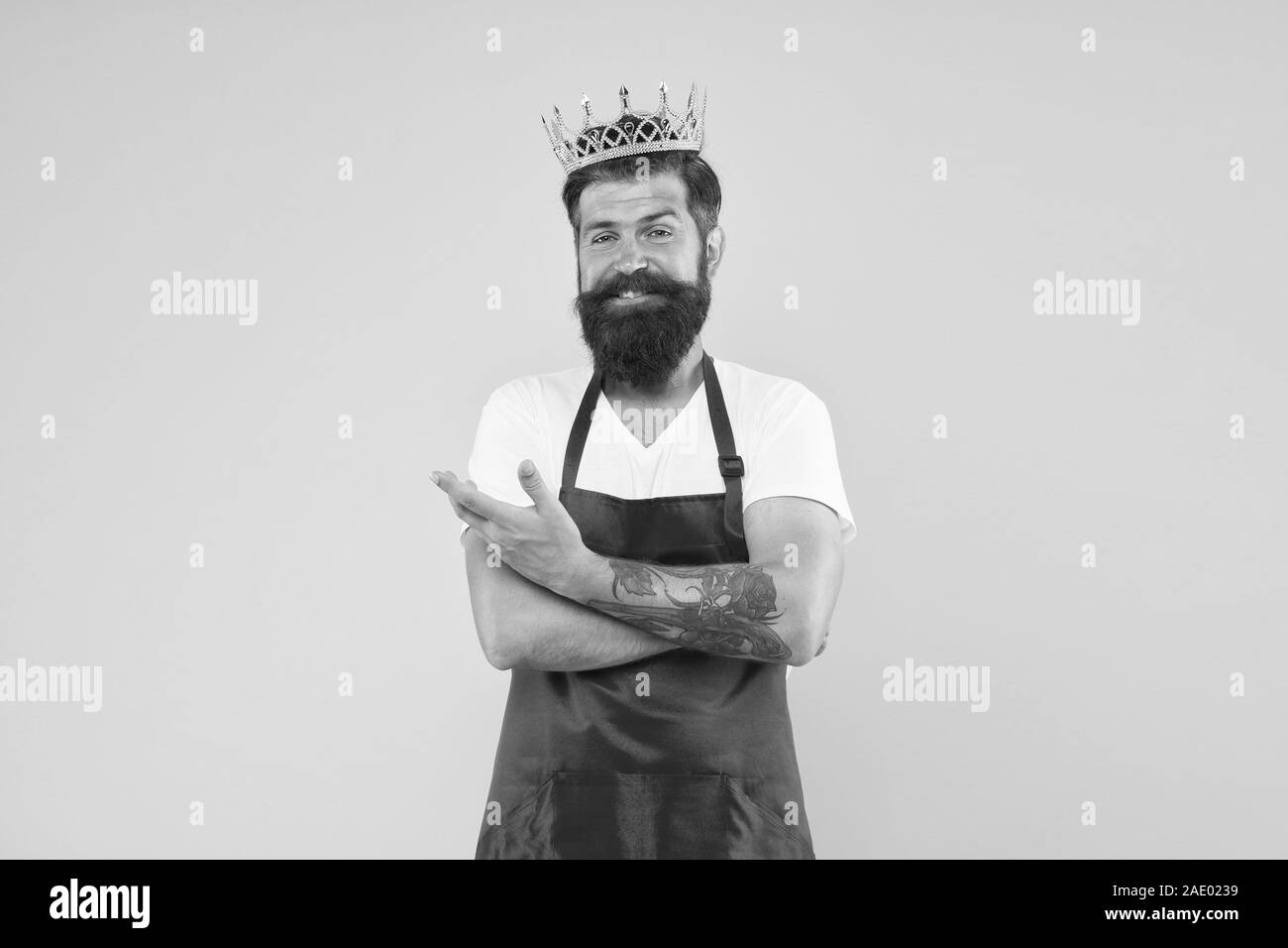 King of kitchen. Cook with beard and mustache yellow background. Royal ...