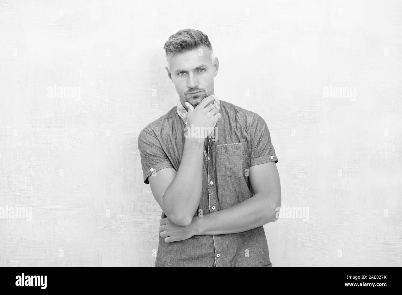 Touching chin. Man mature good looking model. What does it mean being ...