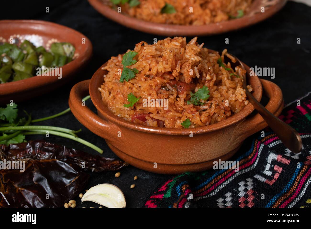 Mexican rice served in traditional clay pot and plate Stock Photo - Alamy