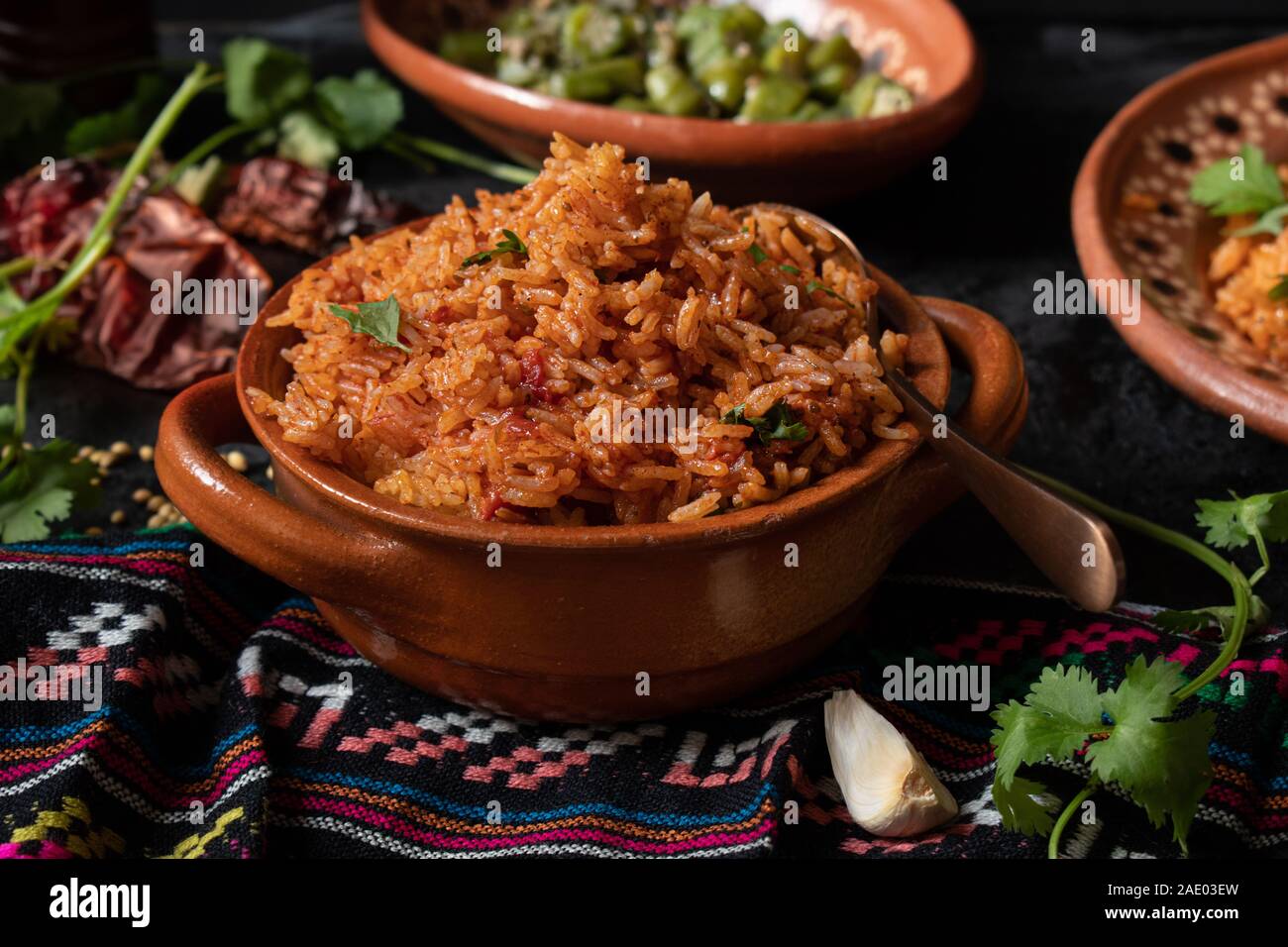 Mexican rice served in traditional clay pot and plate Stock Photo - Alamy