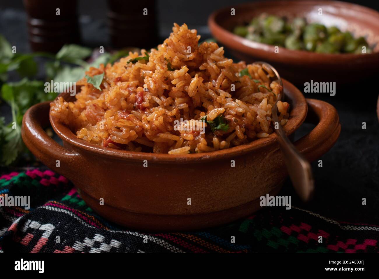 Mexican rice served in traditional clay pot and plate Stock Photo - Alamy
