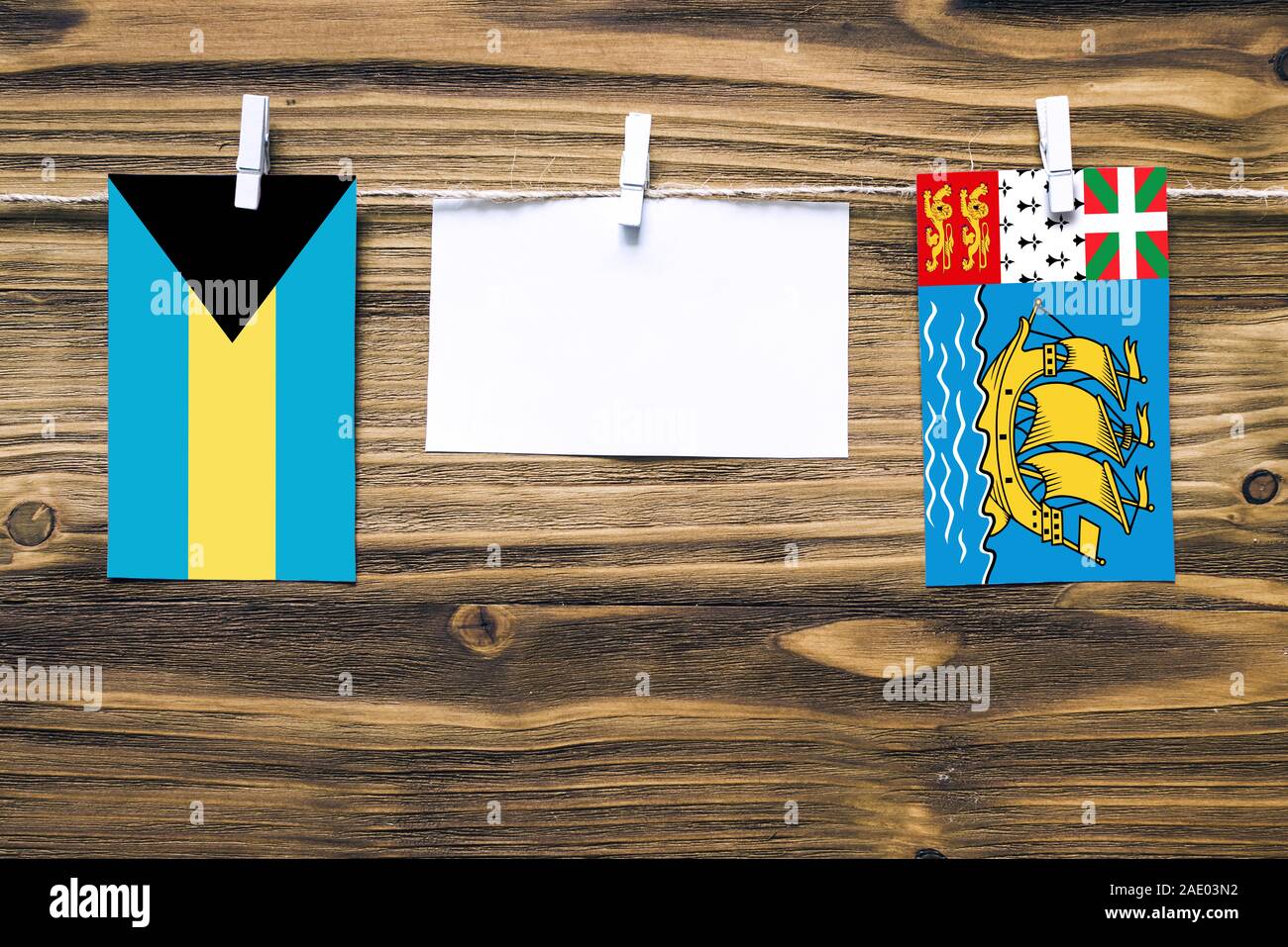 Hanging flags of Bahamas and Saint Pierre And Miquelon attached to rope ...