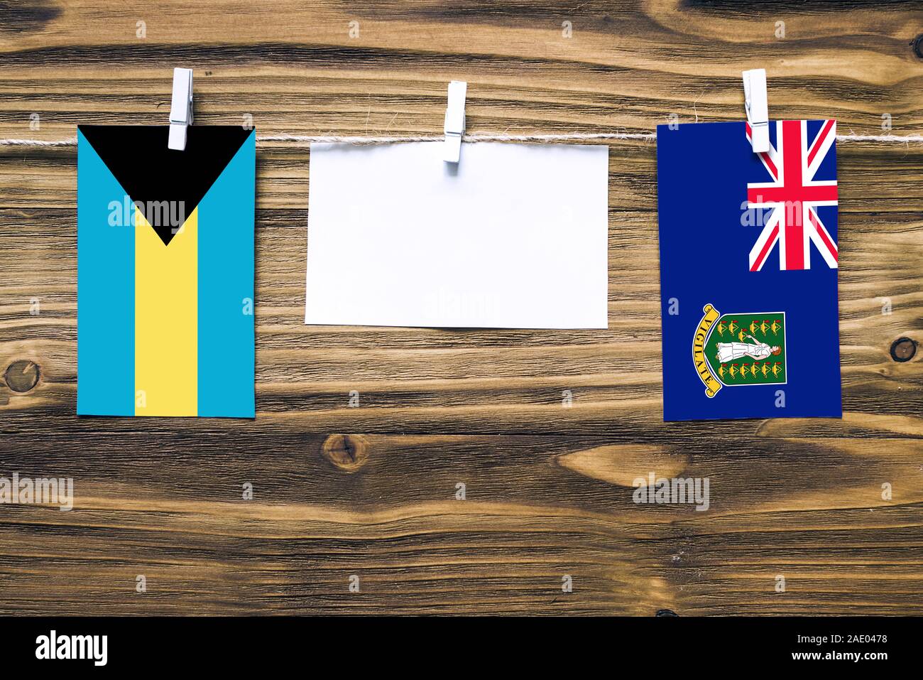 Hanging flags of Bahamas and British Virgin Islands attached to rope ...