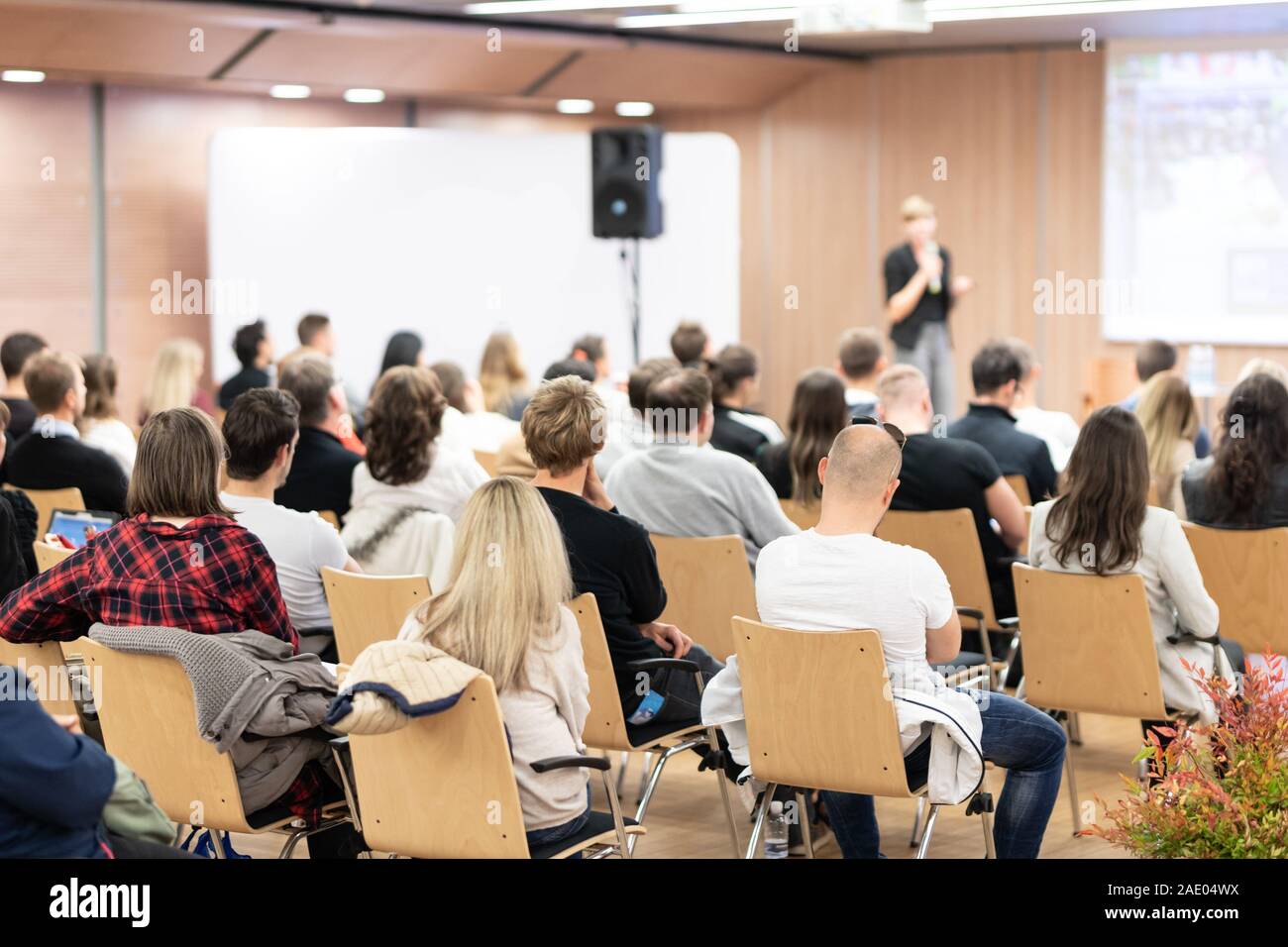 Female speaker giving presentation on business conference Stock Photo ...