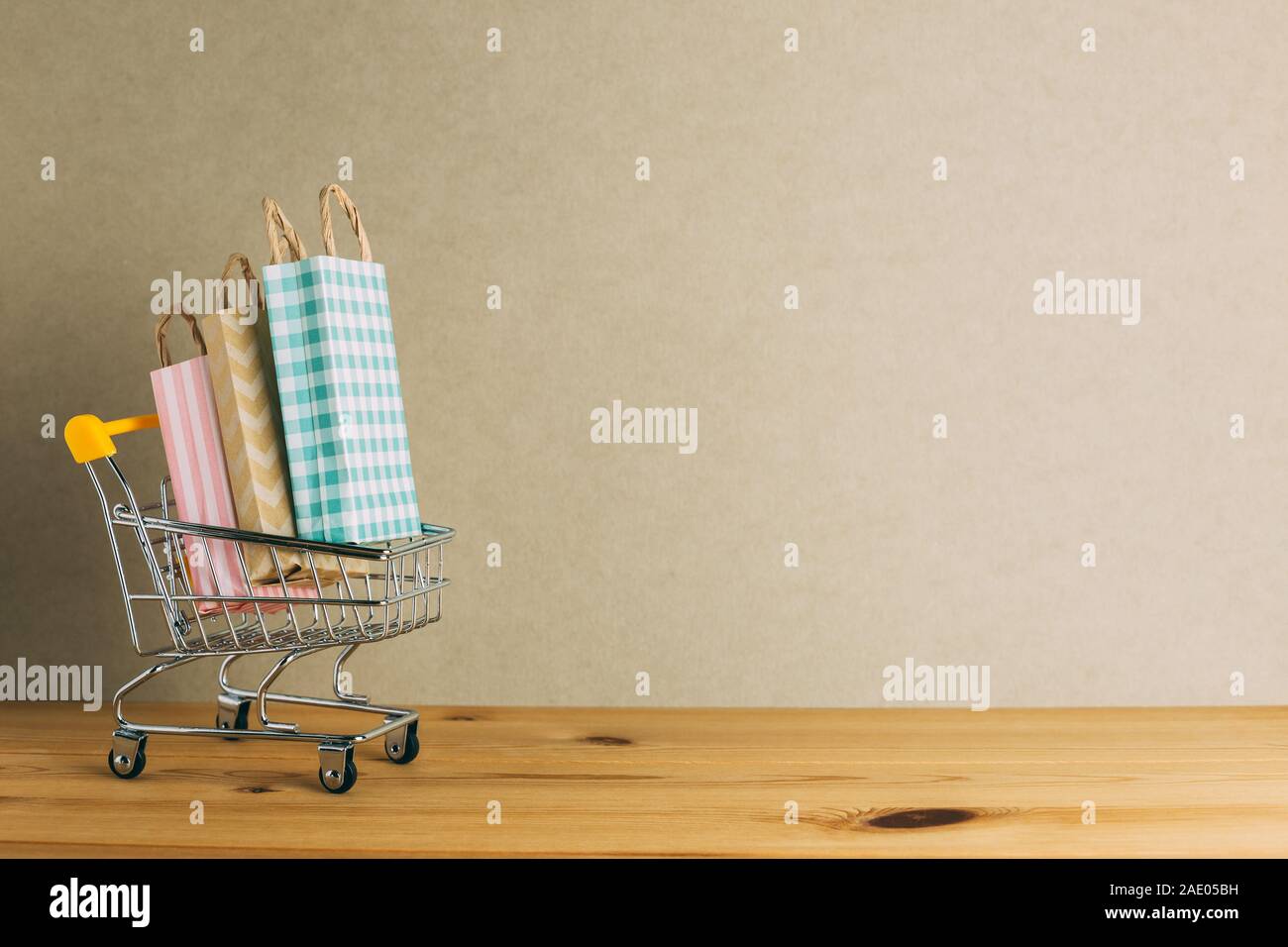 Paper shopping bags in Shopping cart. with copyspace Stock Photo - Alamy