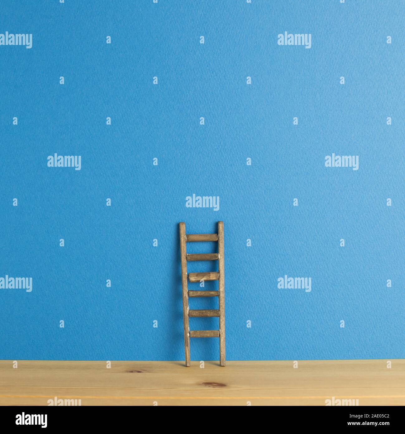 Wooden ladder with blue background. Development growth concept Stock ...